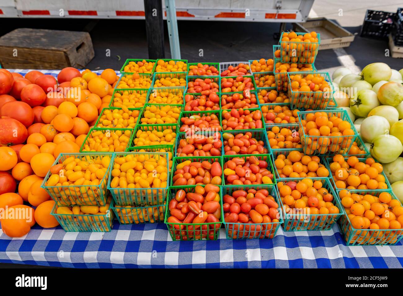 Farmer selling many different vegetables and fruits in a booth at Las ...