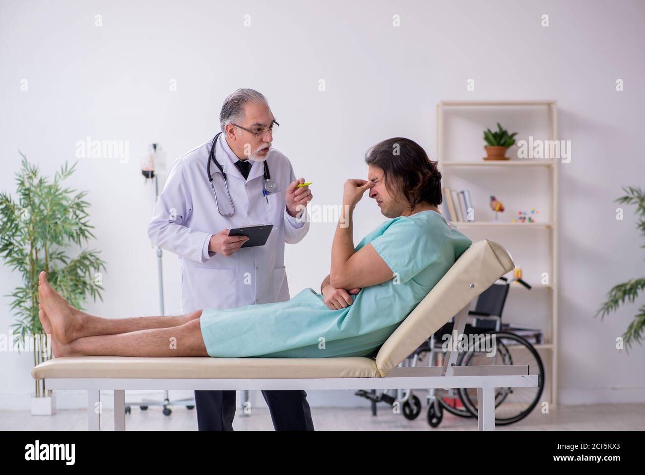 Young patient visiting experienced doctor Stock Photo - Alamy