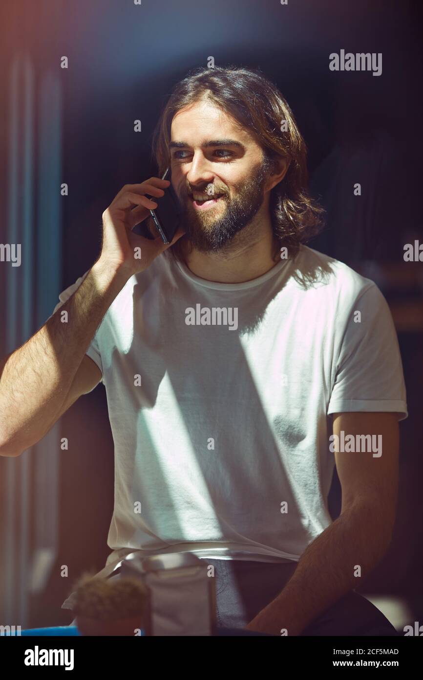 Cheerful handsome man talking hi-res stock photography and images - Alamy