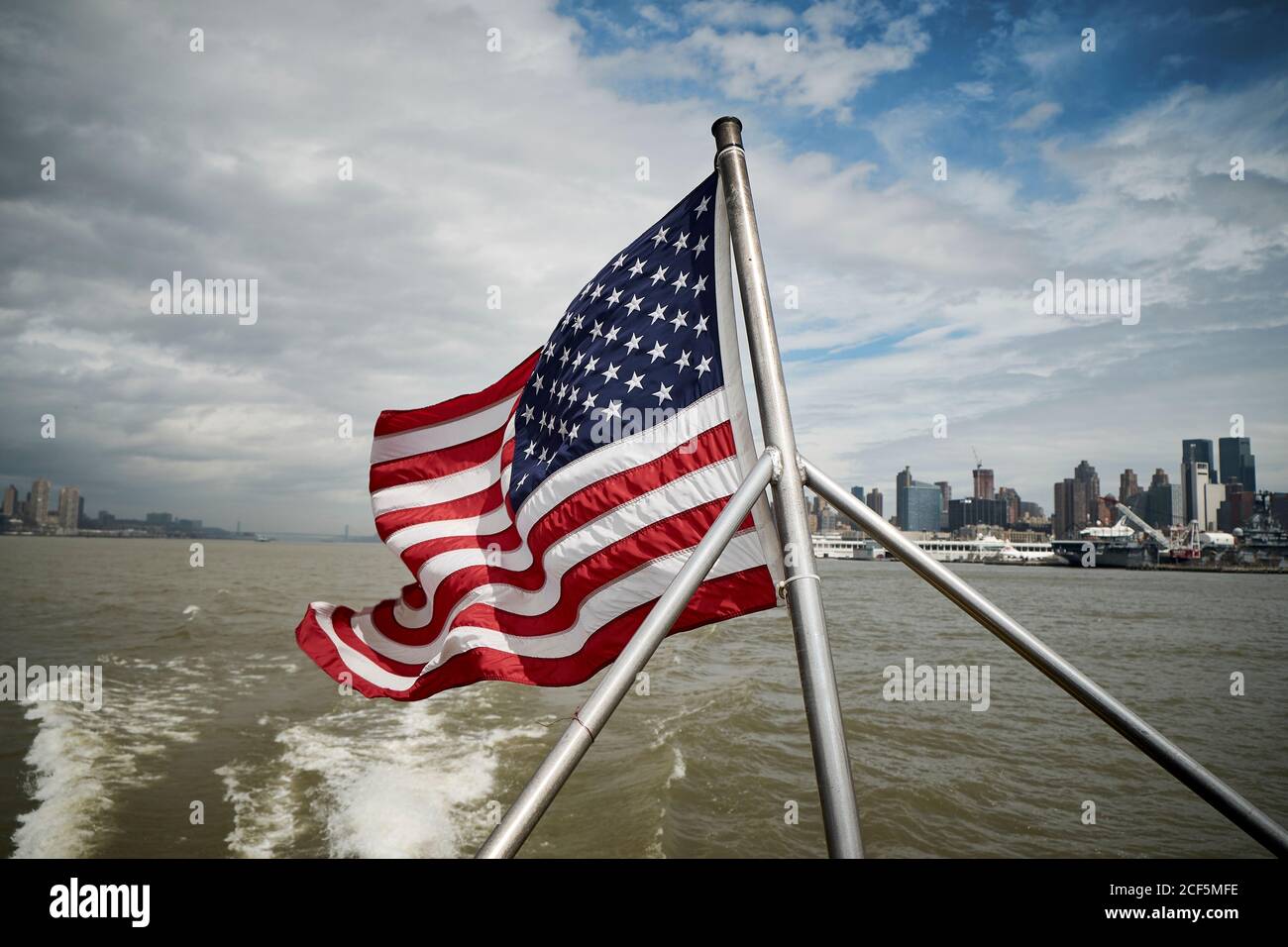 Flag waving near sea against hi-res stock photography and images - Alamy