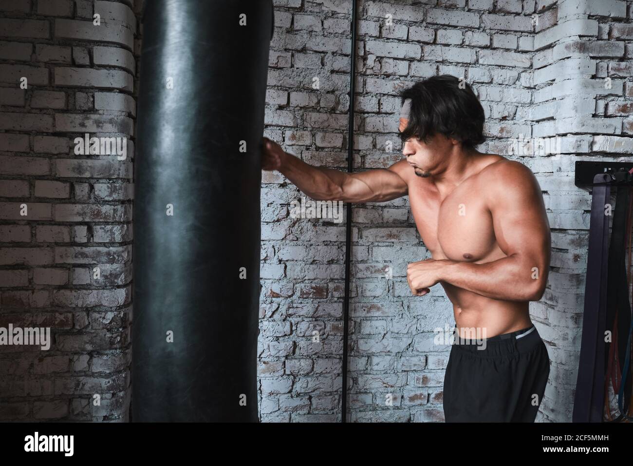 Ethnic guy boxing in gym Stock Photo - Alamy