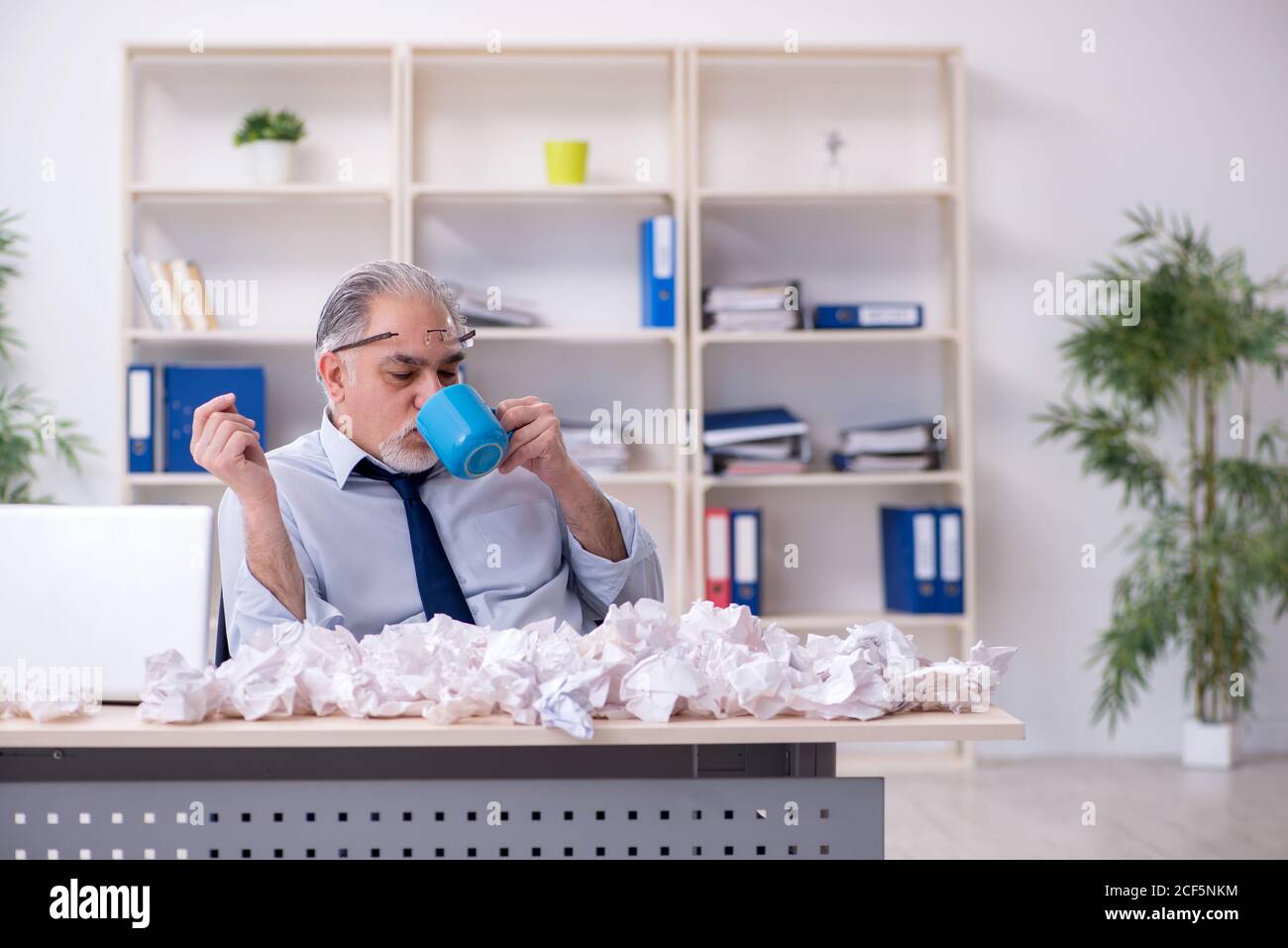 Old businessman rejecting ideas with lots of papers Stock Photo - Alamy