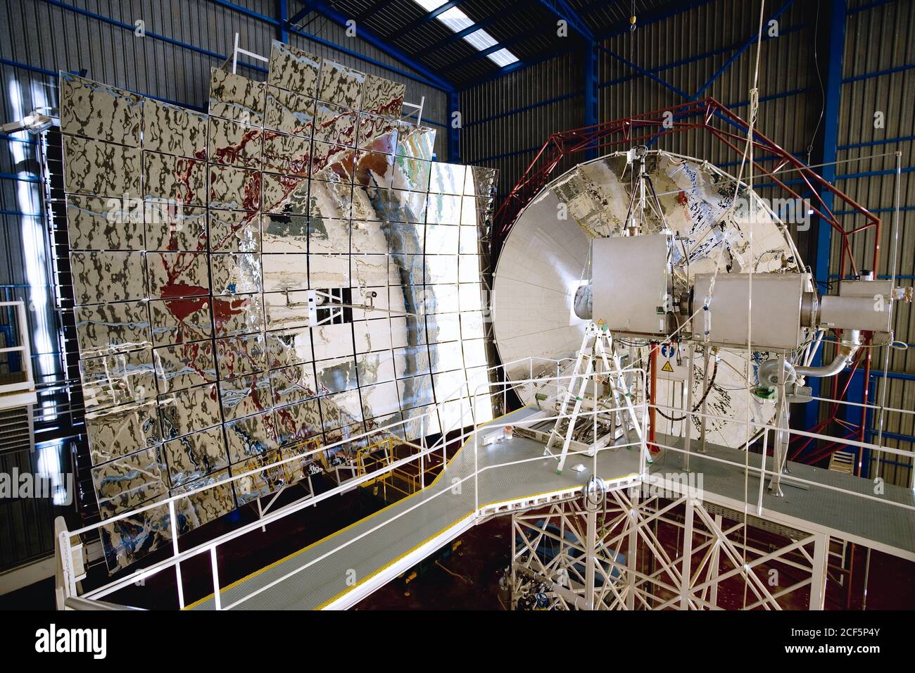 Various modern technology and solar panels installed inside metal shed ...