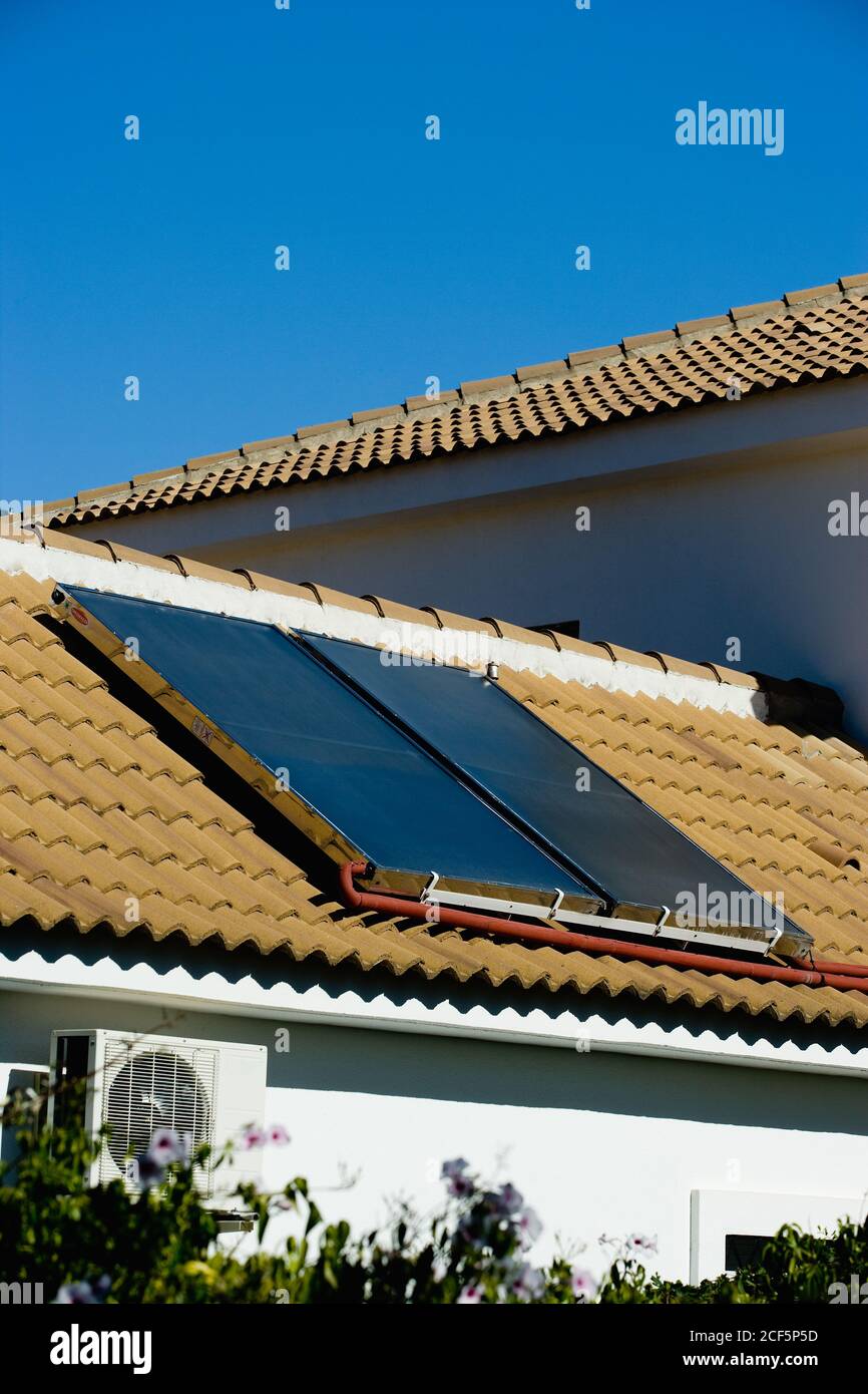 Cottage with roof solar panels hi-res stock photography and images - Alamy