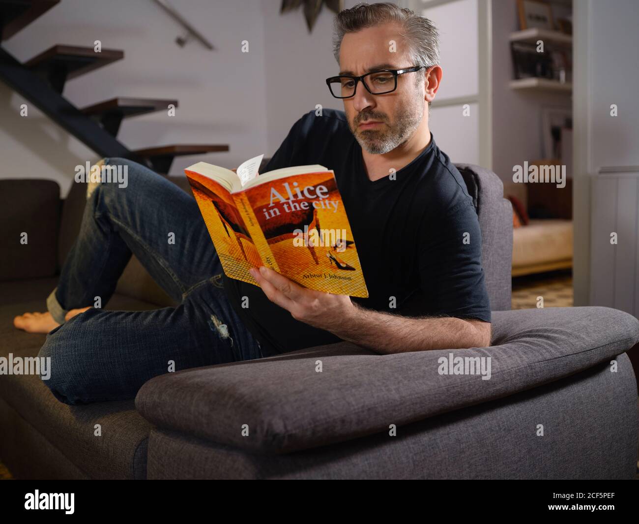 Attractive man reading book hi-res stock photography and images - Alamy