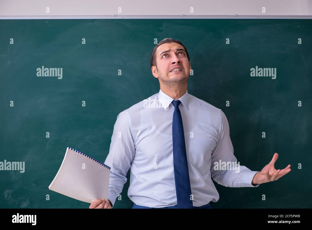 Young man employee presenting in the office Stock Photo - Alamy