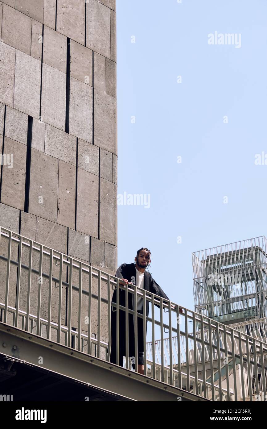 Man leaning on bridge railing hi-res stock photography and images - Alamy