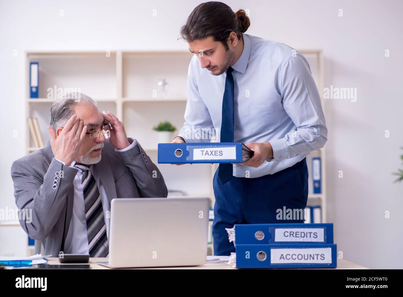 The two accountants working in the office Stock Photo - Alamy