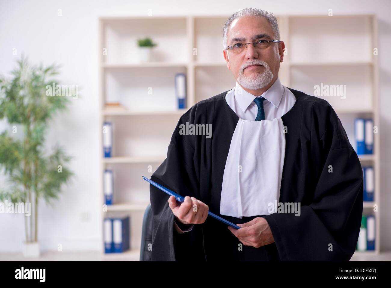 Old judge working in courthouse Stock Photo - Alamy
