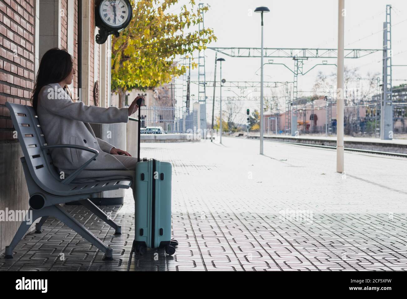 Traveler woman sit on suitcase hi-res stock photography and images - Alamy