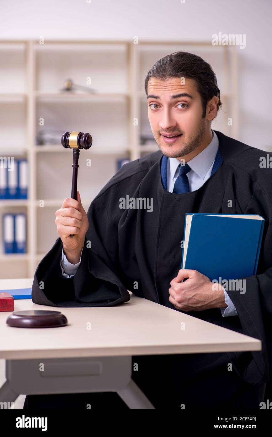 Young judge working in courthouse Stock Photo - Alamy