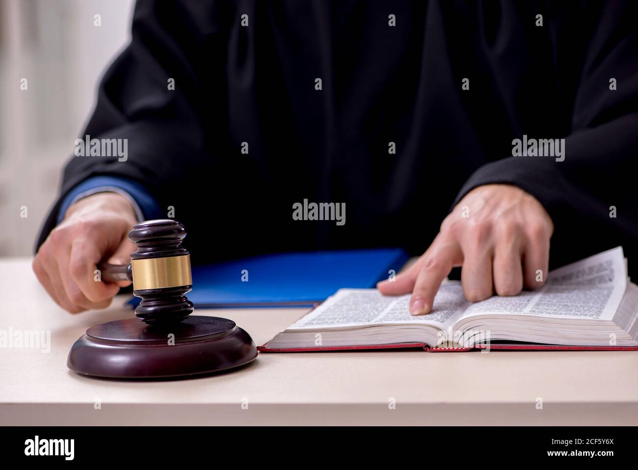 Young judge working in courthouse Stock Photo - Alamy