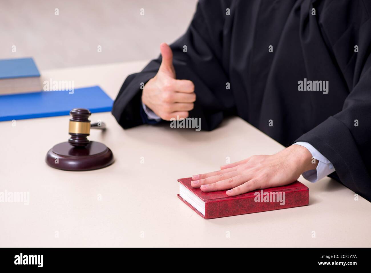 Young judge working in courthouse Stock Photo - Alamy