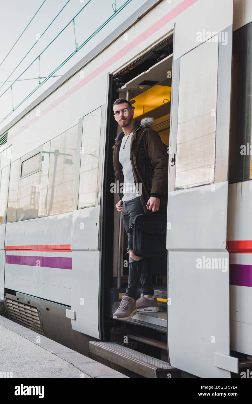 Man walking out door hi-res stock photography and images - Alamy
