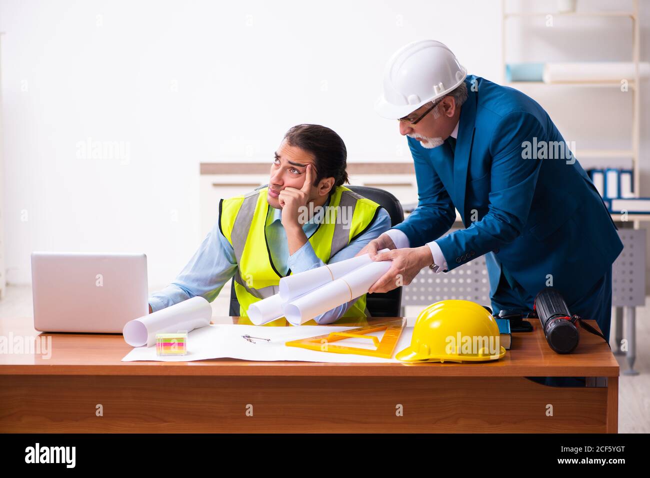 Two architects working in the office Stock Photo - Alamy