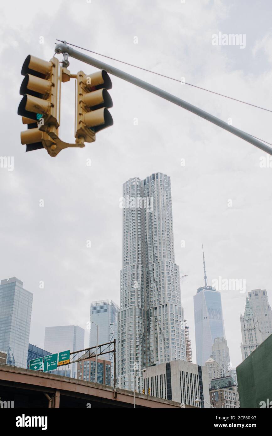 From below of traffic light hanging over road in New York City with ...