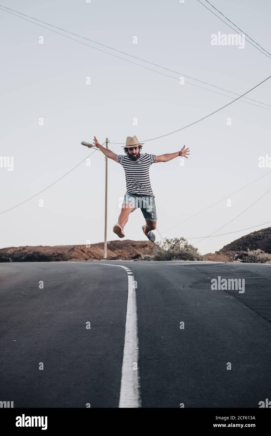Funny active young man jumping hi-res stock photography and images - Alamy