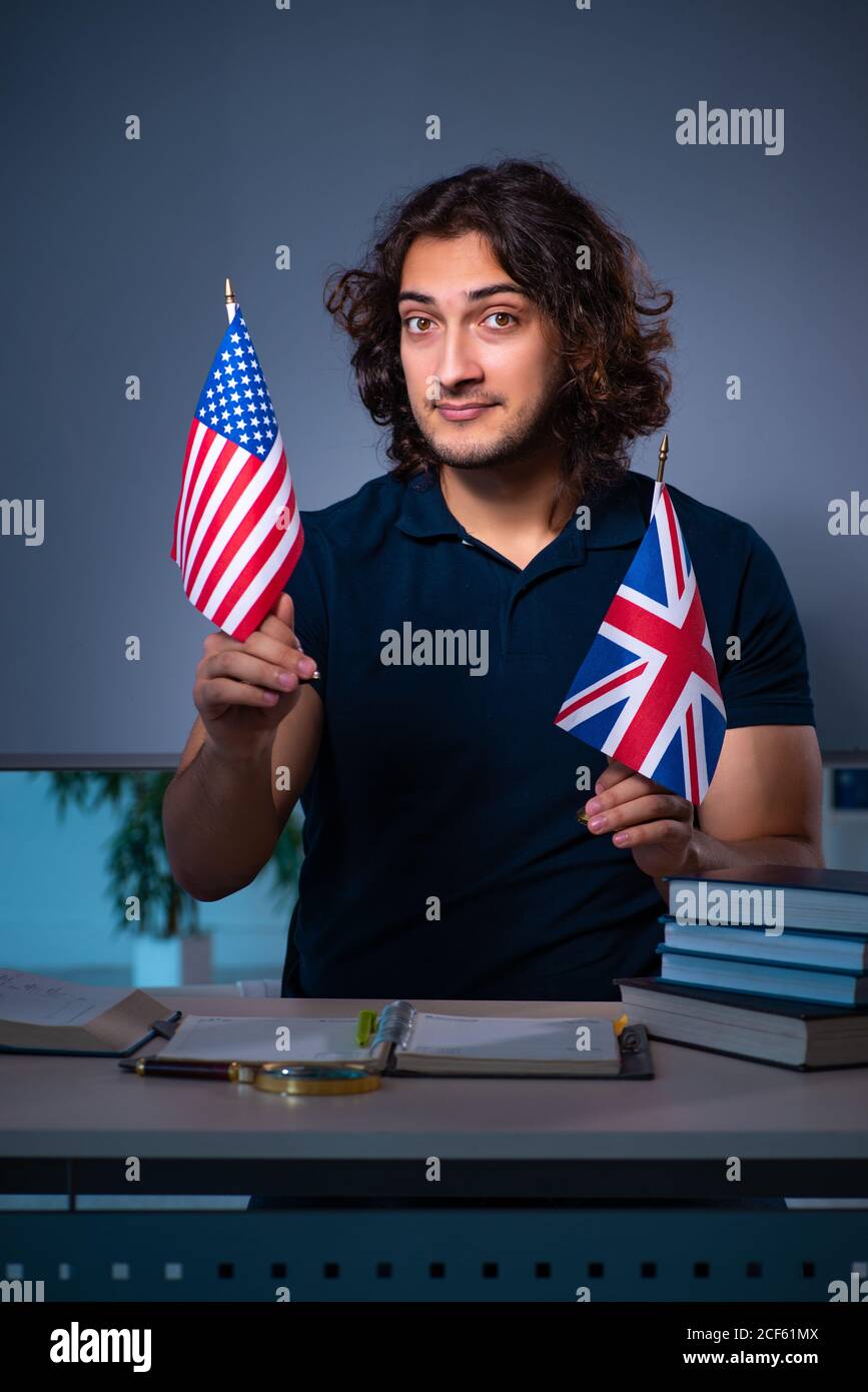 Young student in the classroom at night Stock Photo - Alamy