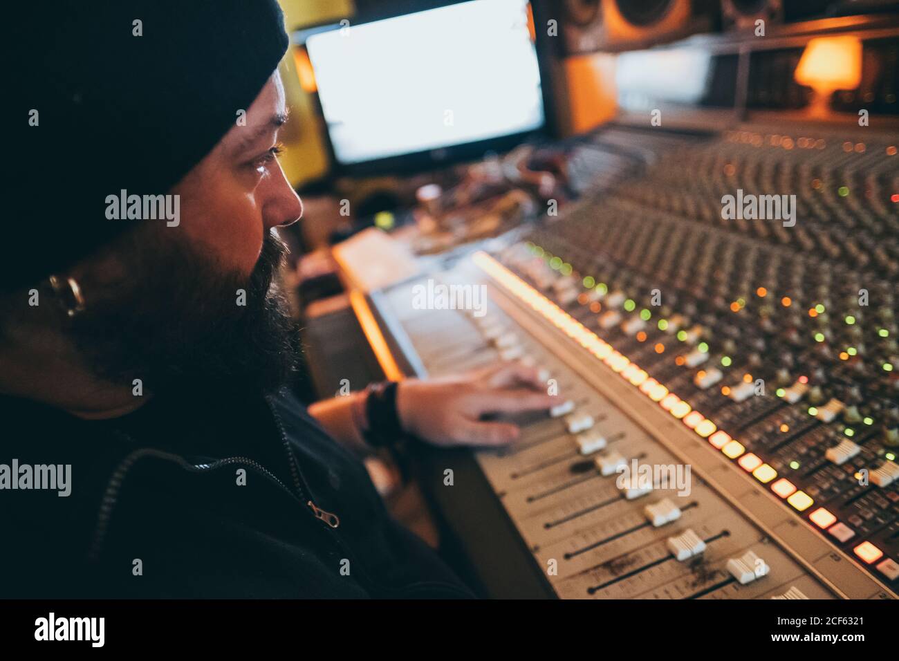 man musician working while playing in a equalizer instrument in a ...