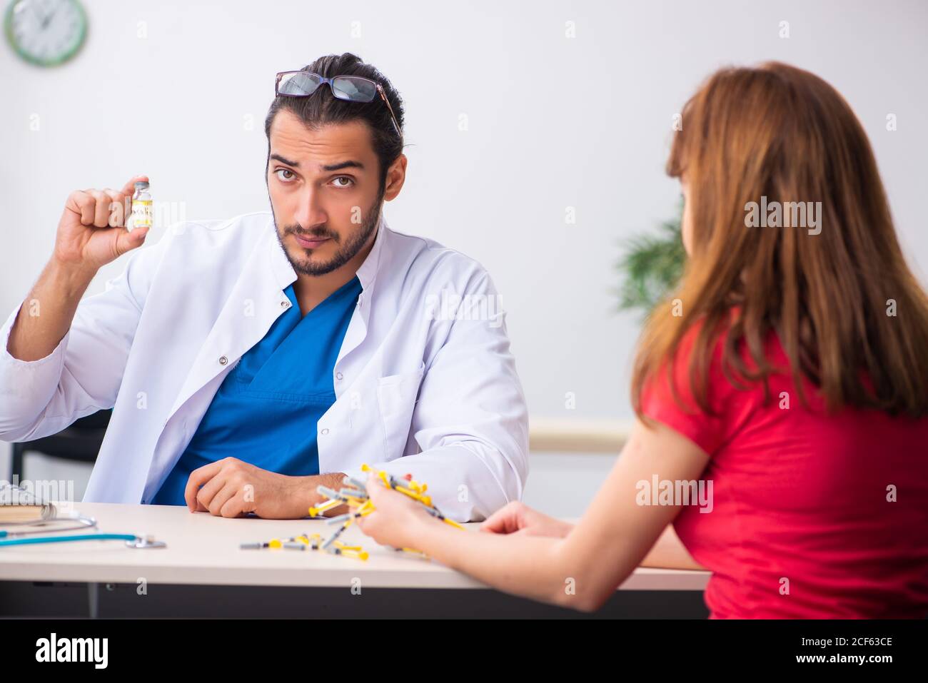 Female diabetic patient visiting young doctor Stock Photo - Alamy