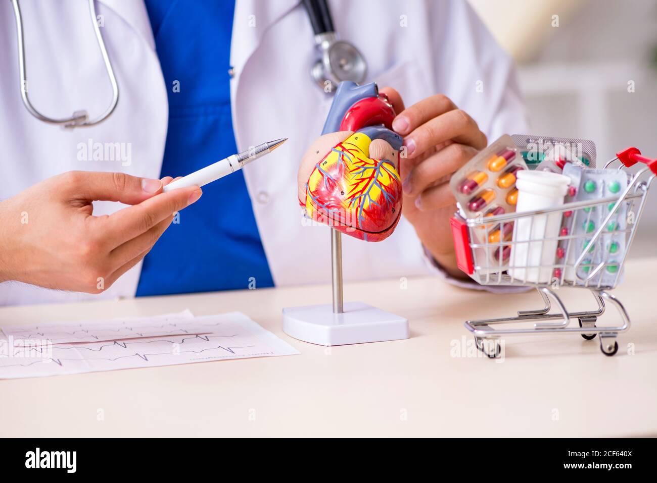 Young doctor cardiologist working in the clinic Stock Photo - Alamy