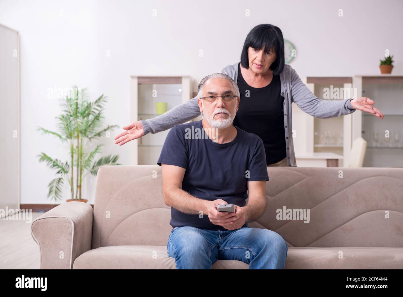Old couple having argument at the home Stock Photo - Alamy