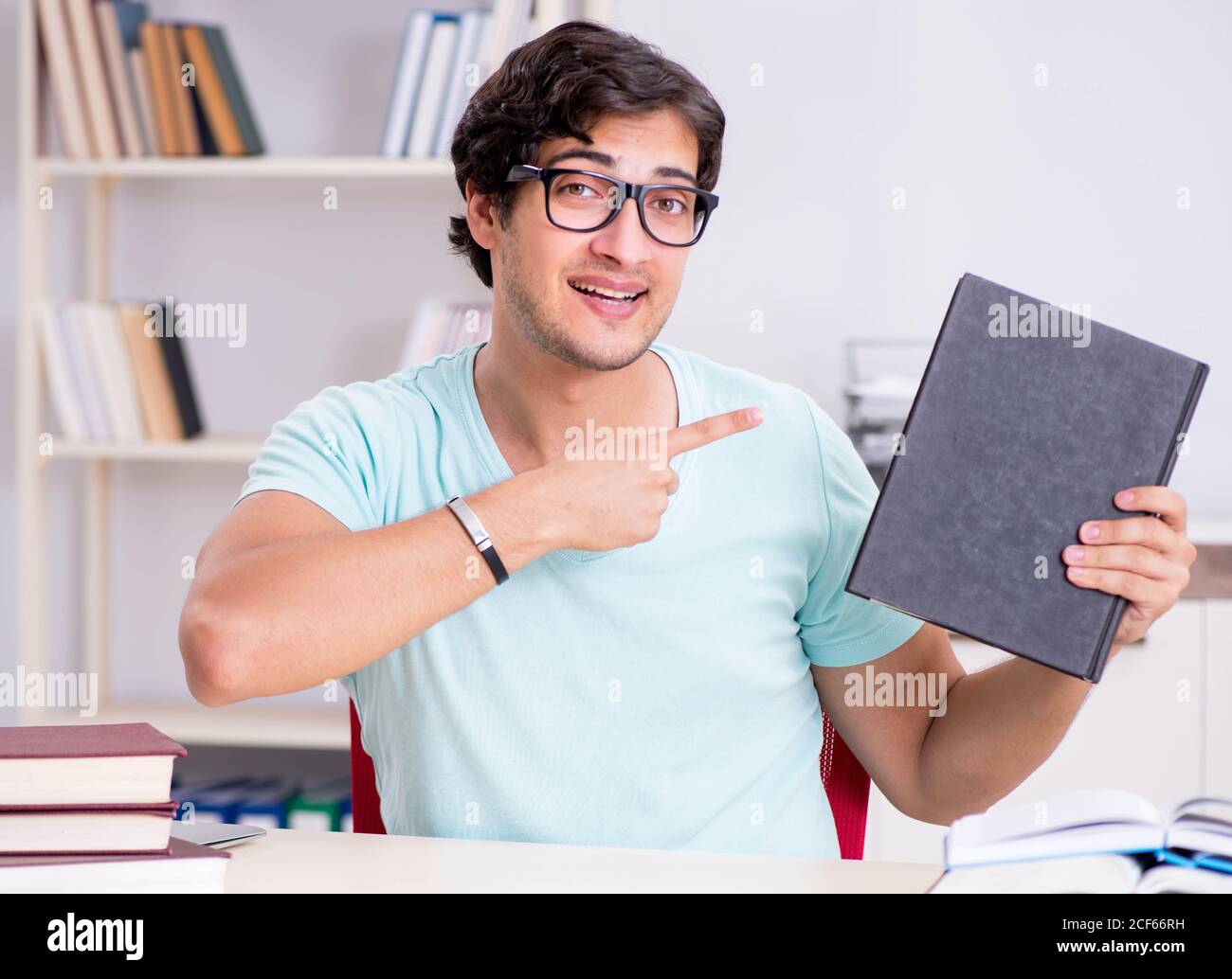 The young handsome student preparing for school exams Stock Photo - Alamy