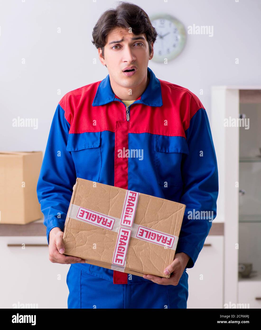 The transportation contractor with fragile boxes Stock Photo - Alamy