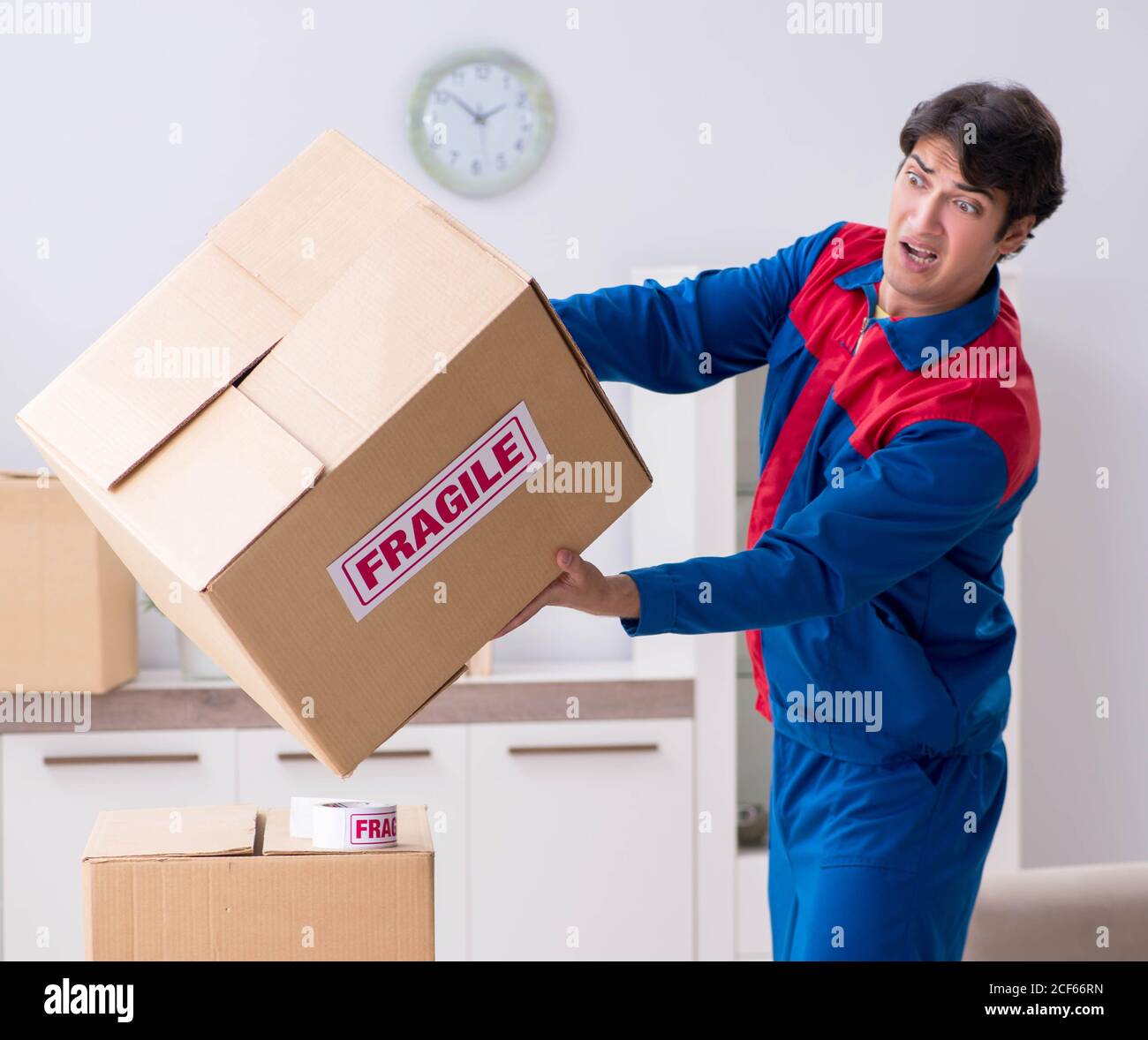 The transportation contractor with fragile boxes Stock Photo - Alamy