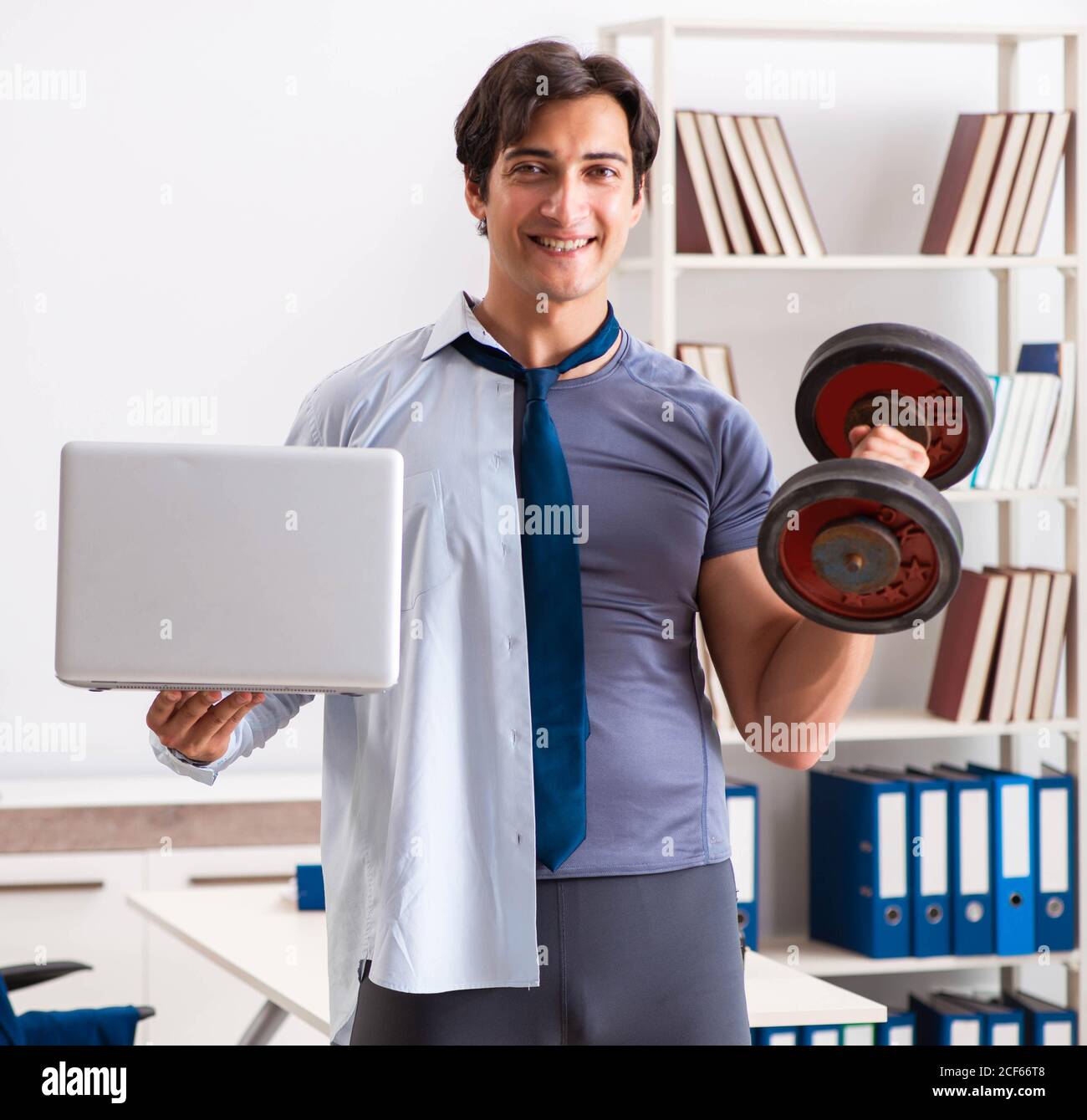 The employee combining work and healthy lifestyle Stock Photo - Alamy
