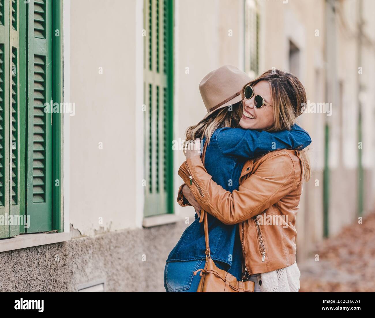 Friends hug greeting hi-res stock photography and images - Alamy
