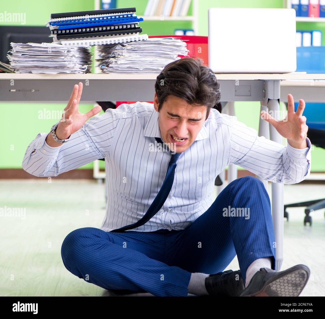 The frustrated businessman stressed from excessive work Stock Photo - Alamy