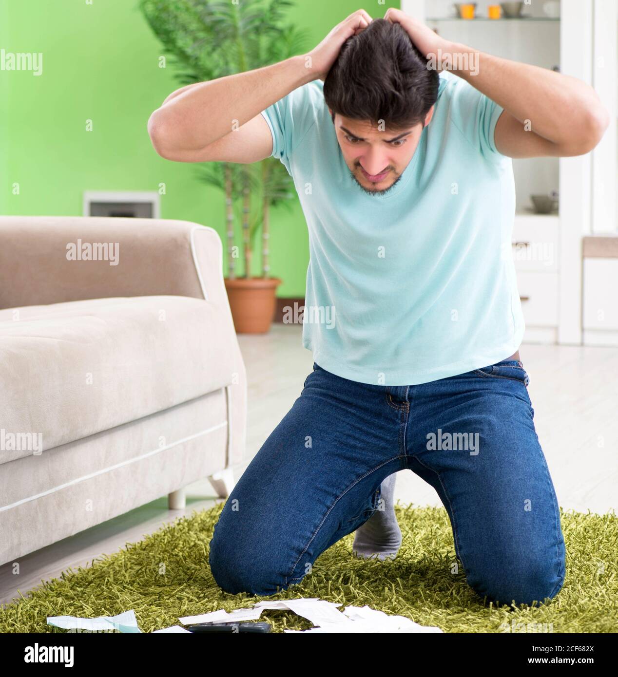 The young man struggling with personal finance and bills Stock Photo ...