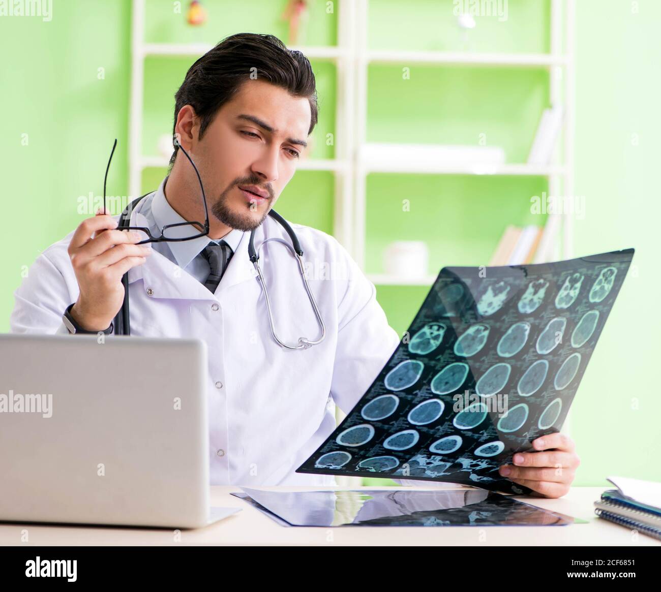 The doctor radiologist looking at x-ray scan in hospital Stock Photo ...