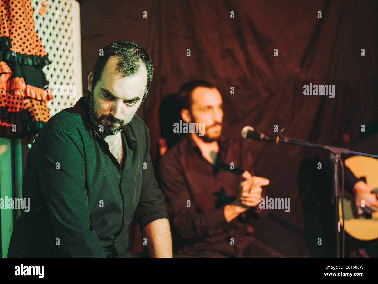 Group of Hispanic artists singing flamenco song and playing guitar ...
