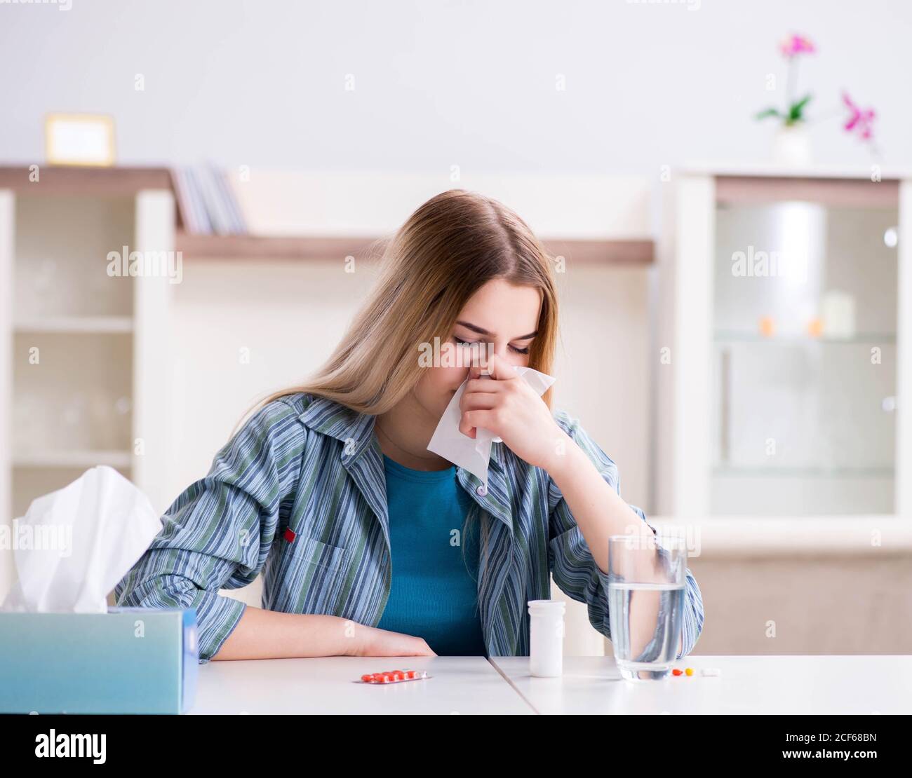 The woman taking pills to cope with pain Stock Photo - Alamy
