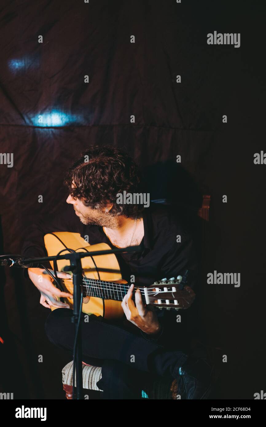 Hispanic guitarist giving performance on theater stage Stock Photo - Alamy