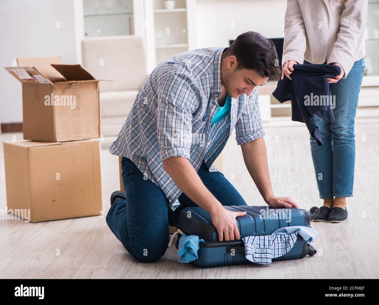 The woman evicting man from house during family conflict Stock Photo ...