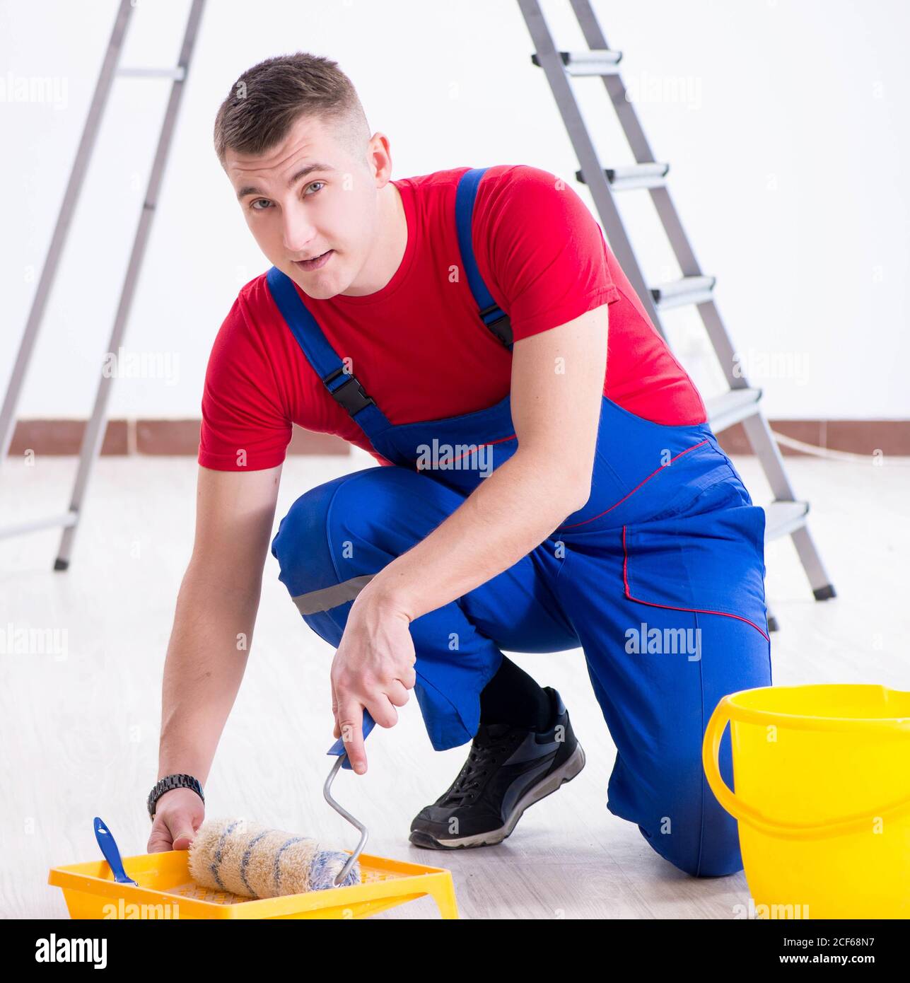 The male painter preparing for painting job at construction site Stock ...