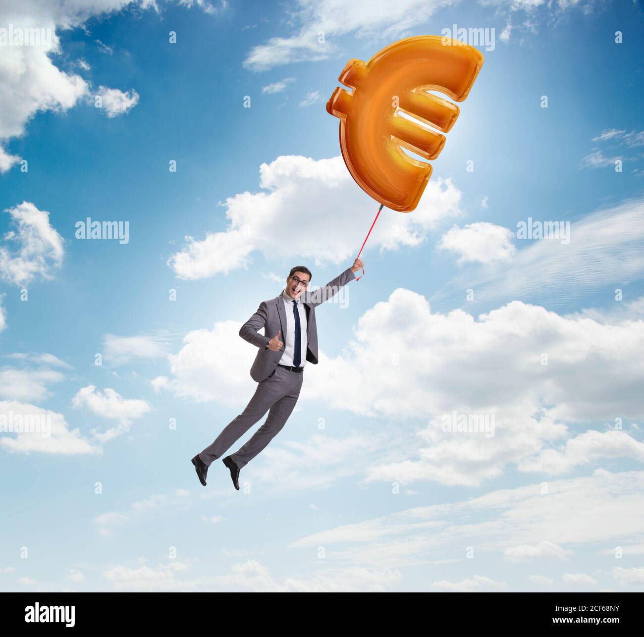 The businessman flying on euro sign inflatable balloon Stock Photo - Alamy