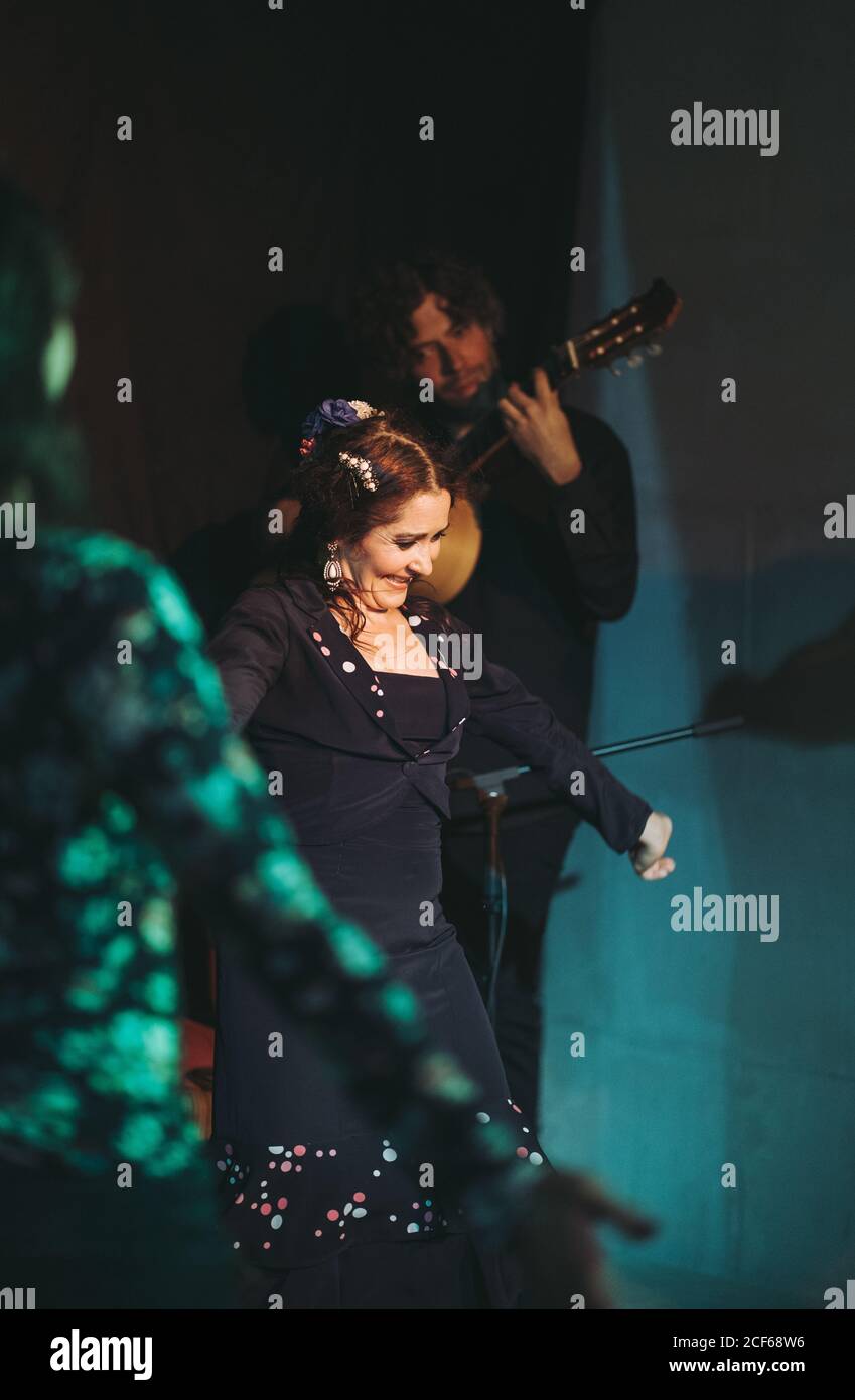 Trio of Hispanic artists giving flamenco performance on theater stage ...