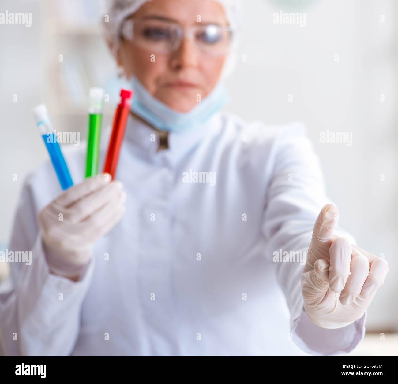 The woman chemist pressing virtual button in lab Stock Photo - Alamy