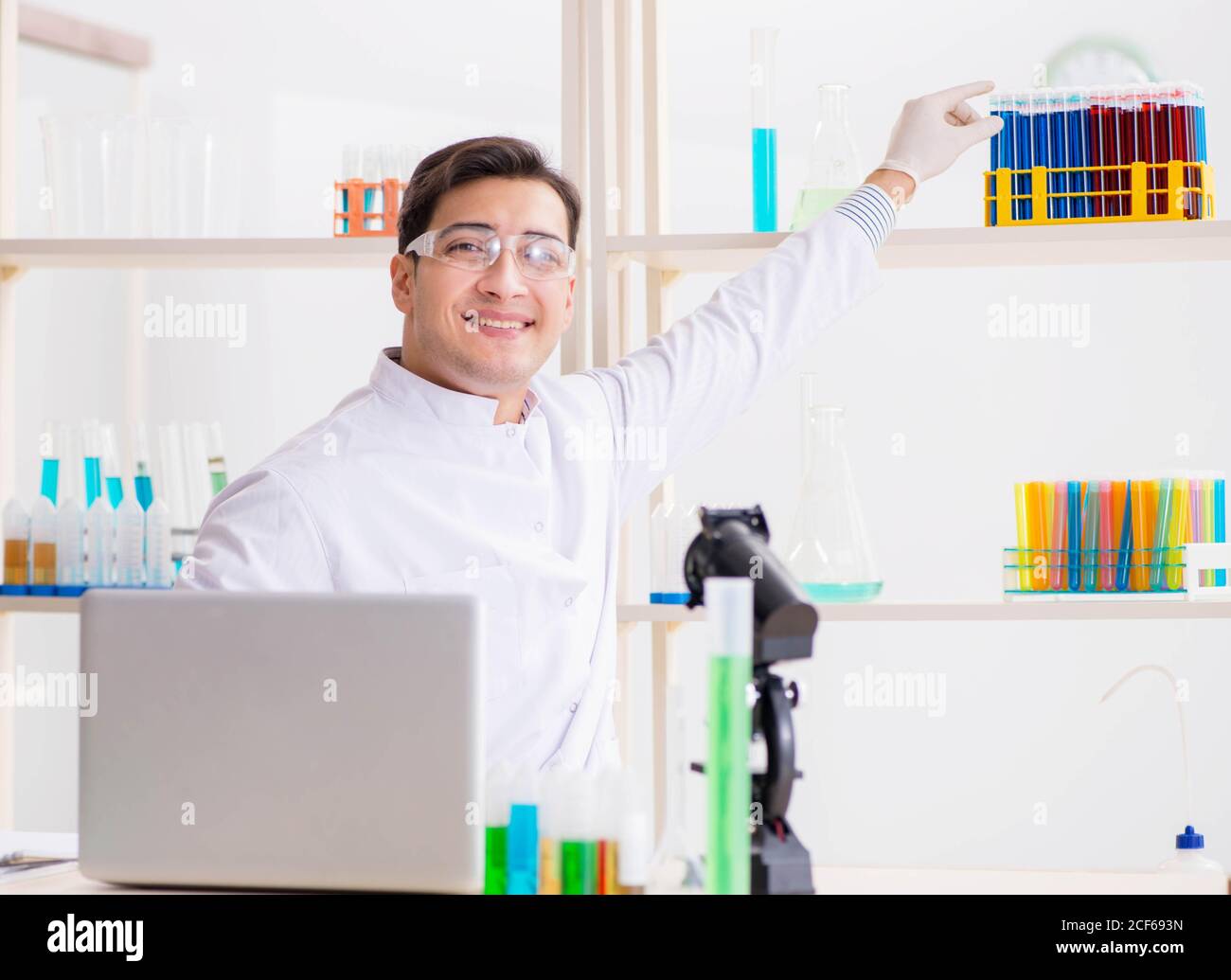 The man student working in chemical lab on experiment Stock Photo - Alamy