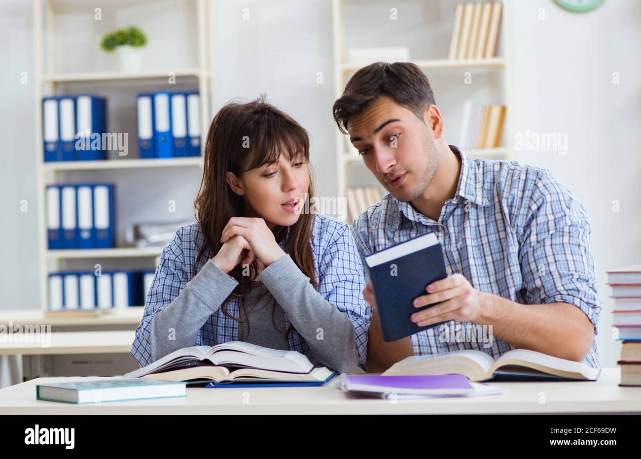 The students sitting and studying in classroom college Stock Photo - Alamy