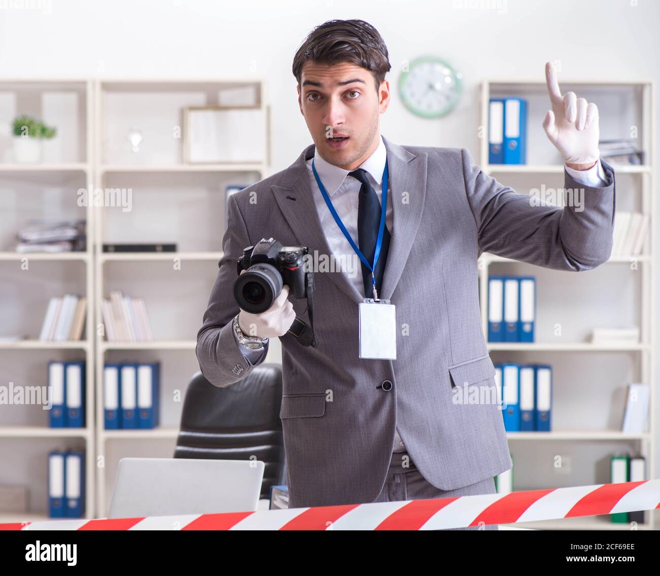 The forensics investigator at the scene of office crime Stock Photo - Alamy