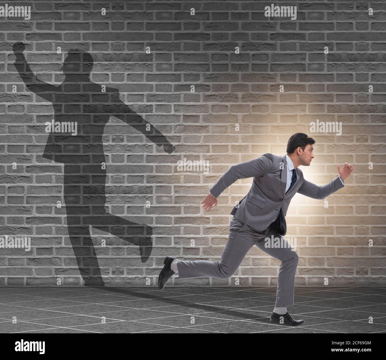 The businessman and his shadow in business concept Stock Photo - Alamy
