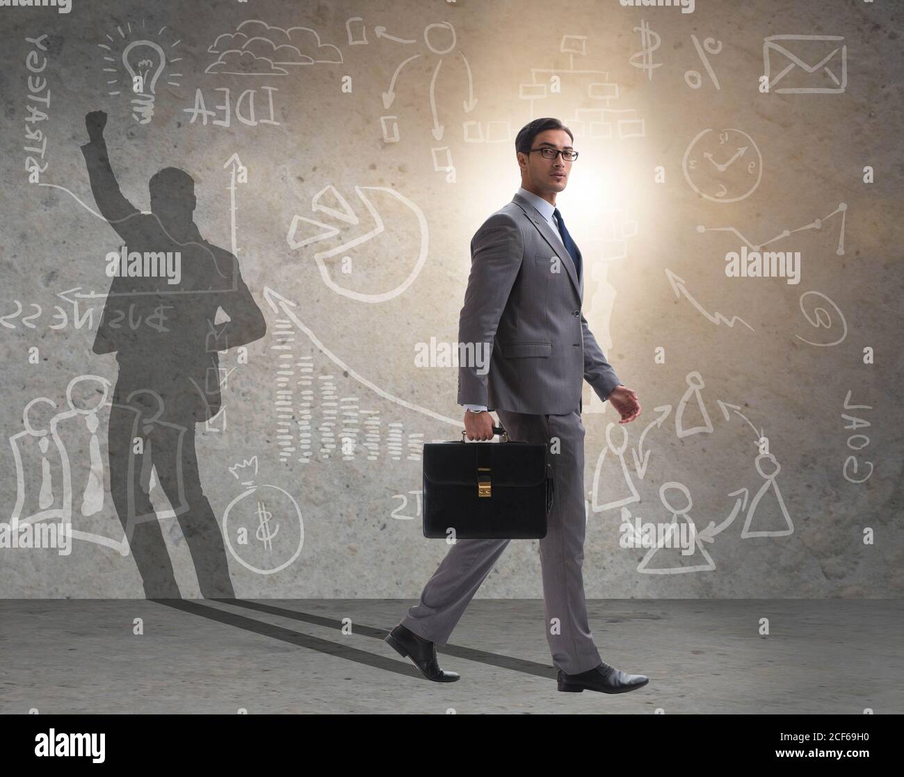 The businessman and his shadow in business concept Stock Photo - Alamy