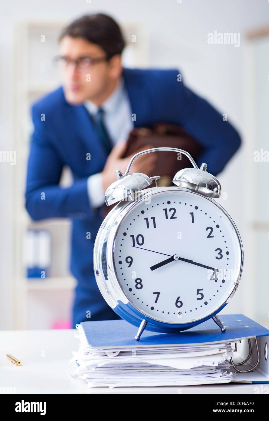 The businessman in bad time management concept Stock Photo - Alamy