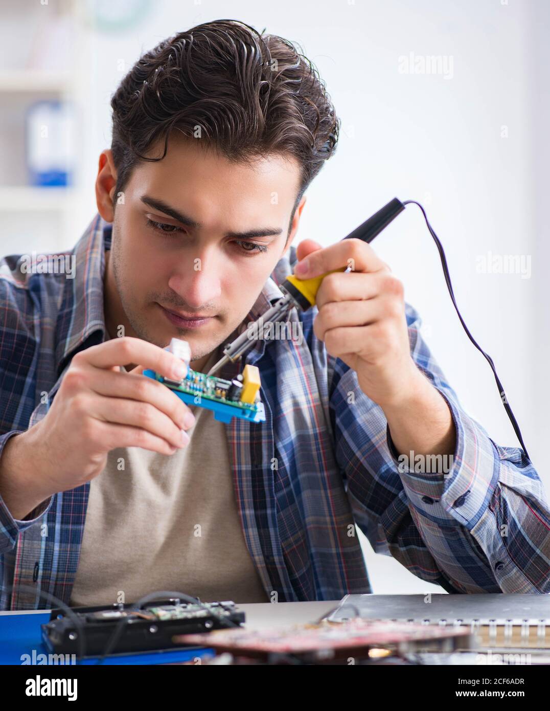 Computer hardware repair and fixing concept by experienced technician ...