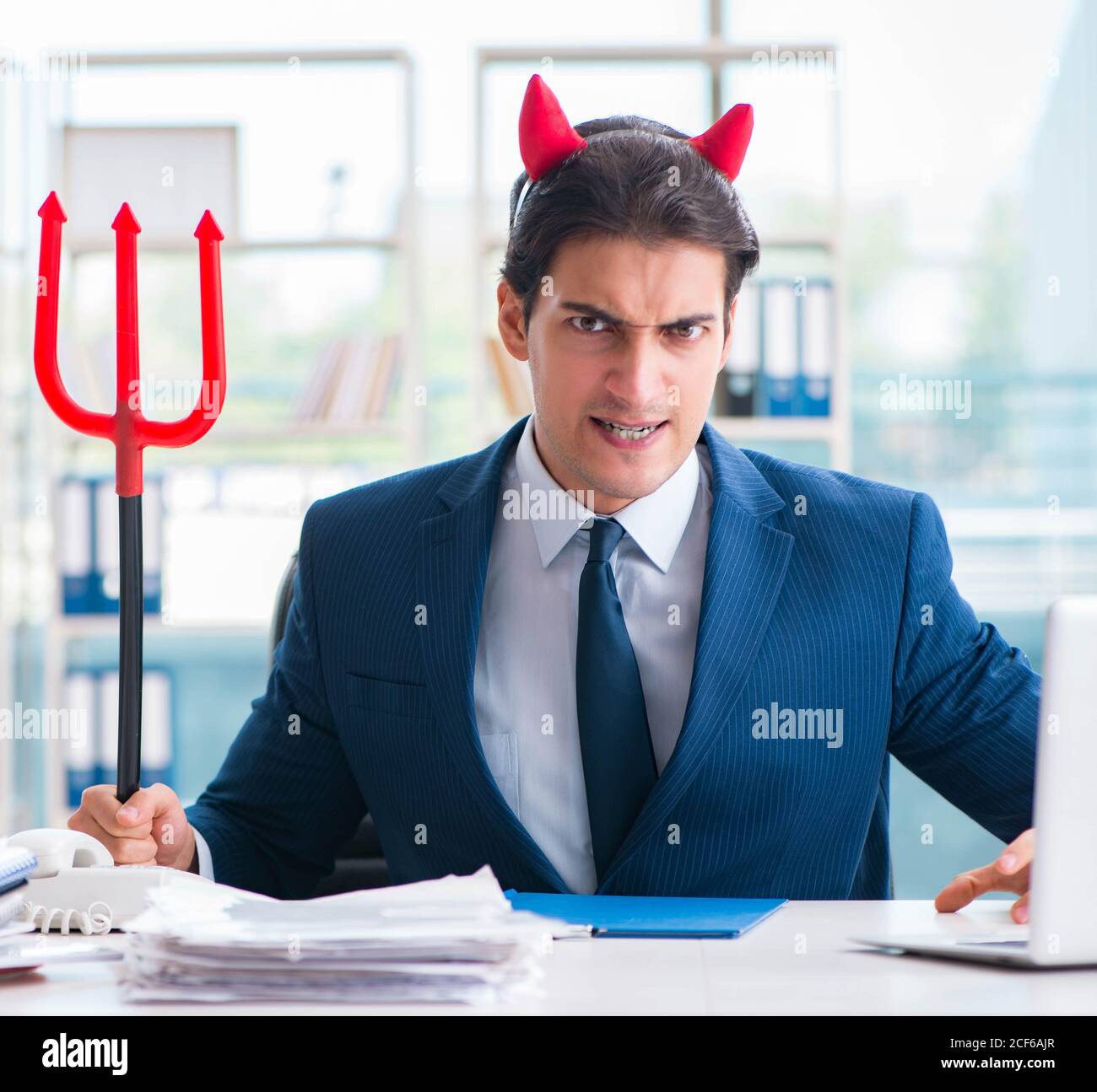 The devil angry businessman in the office Stock Photo - Alamy